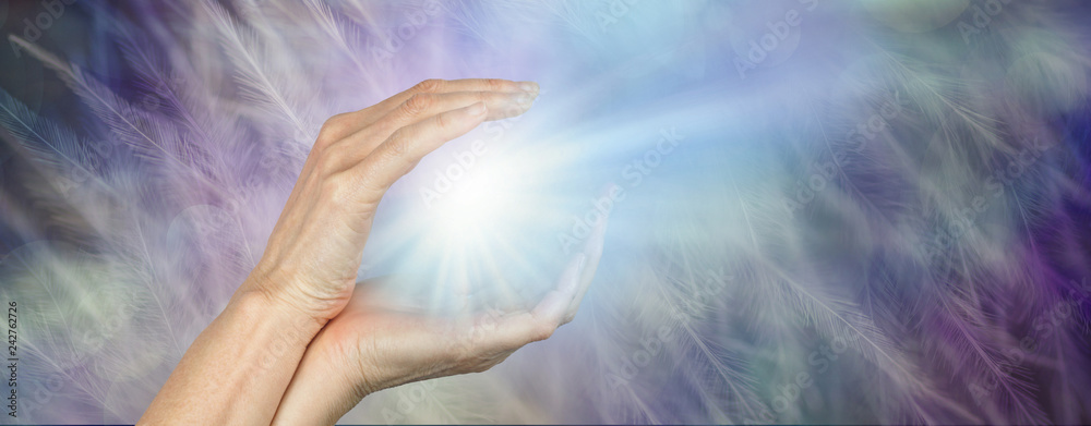 Healing Orb Light Phenomenon - female hands cupped around a bright ...