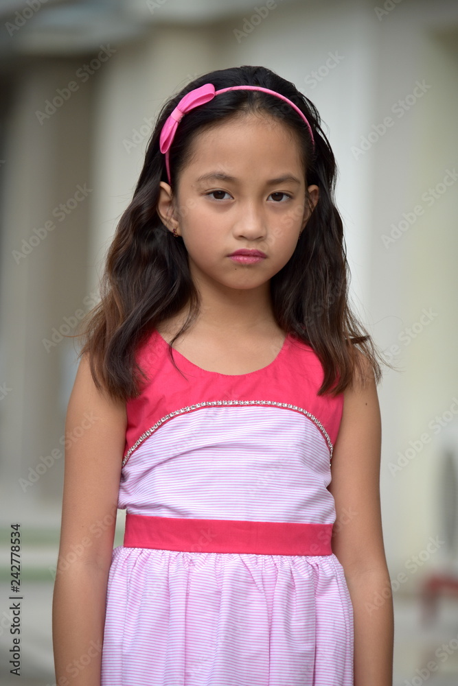 Serious Pretty Filipina Teen Girl Stock Photo | Adobe Stock