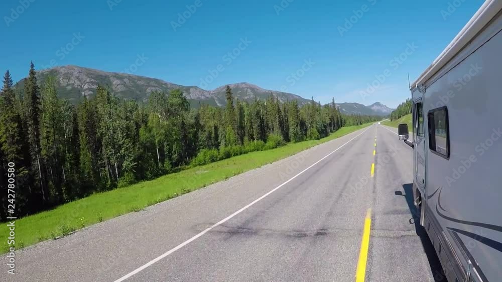 Side view of an rv motorhome driving during the summer in British ...