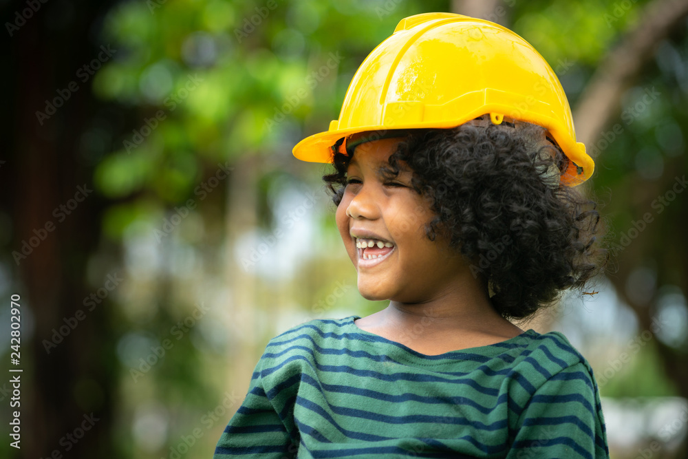 Happy little boy engineer wearing yellow safety helmet hard hat and ...