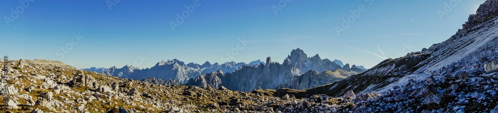 Panorama, widescreen mountain atmospheric view of the Alps with clouds ...