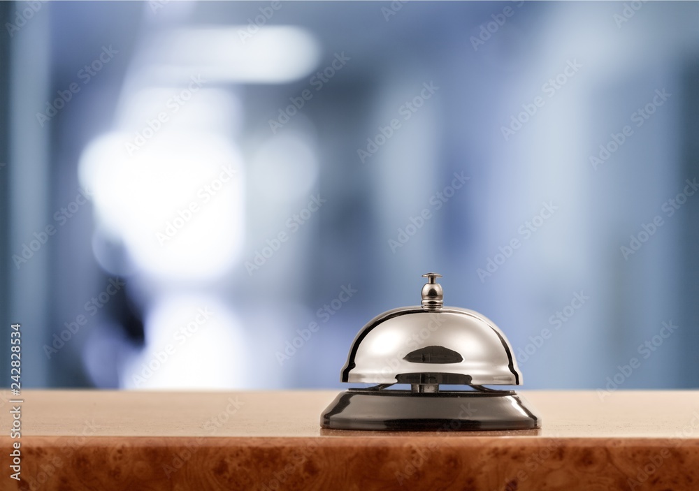 Vintage hotel reception service desk bell on blurred background Stock ...