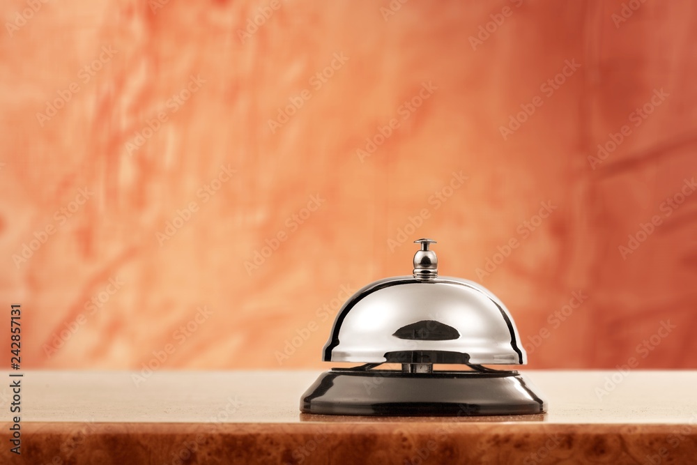 Vintage hotel reception service desk bell on blurred background Stock ...