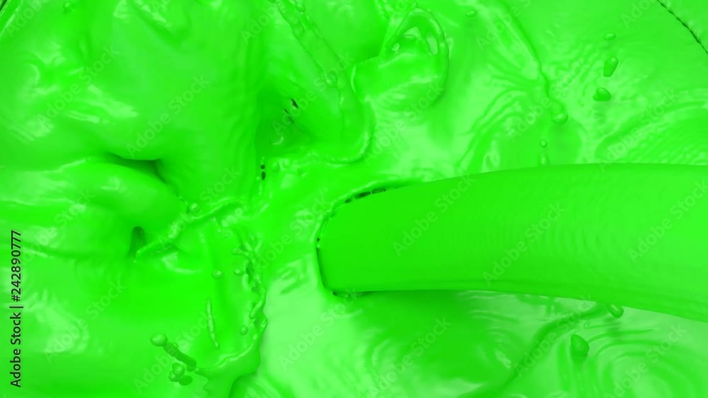 Animated top view and close up view of green paint or other thick ...