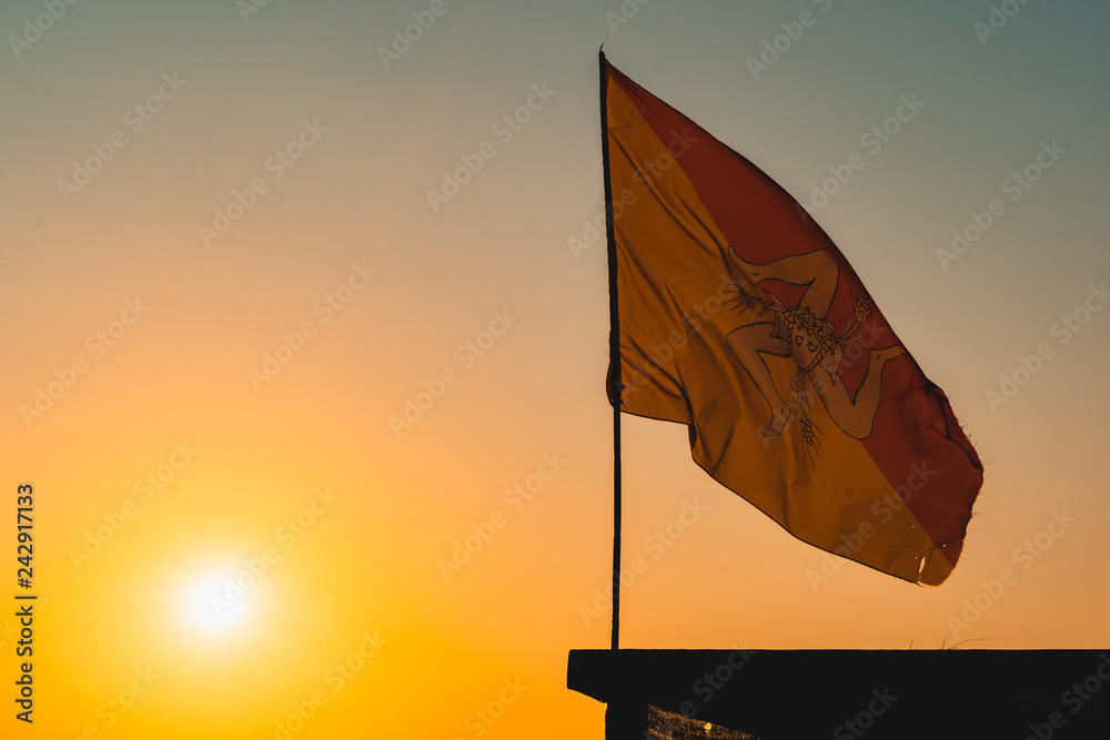 sicilian flag at sunset Stock Photo | Adobe Stock