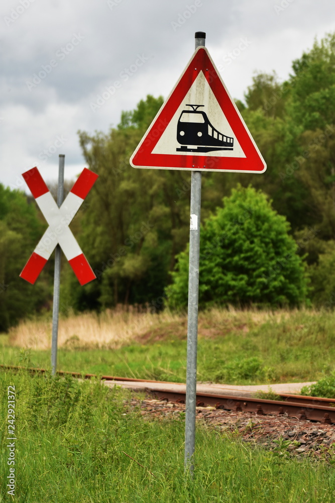 The Cross of St. Andrew ,traffic signs for a railroad crossing in ...