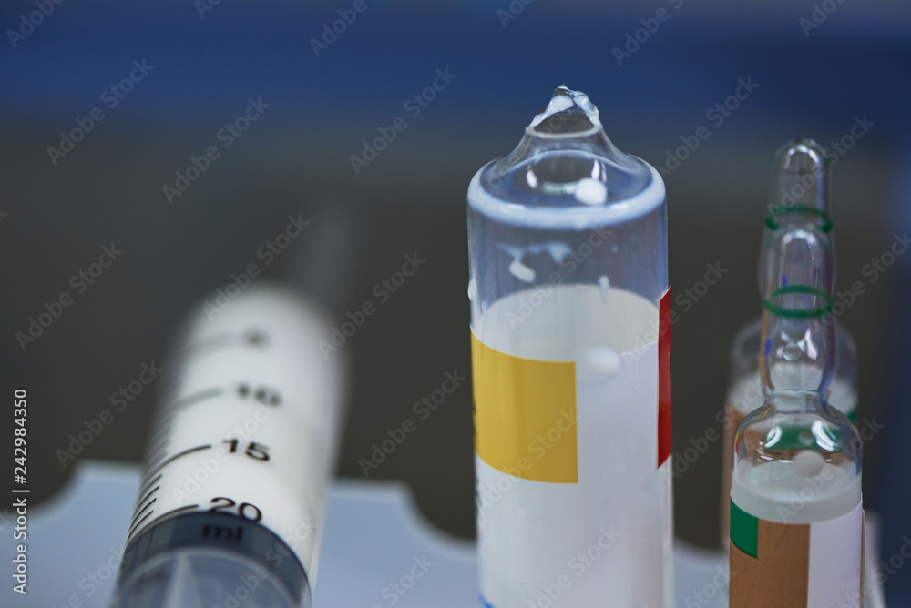 Broken vial of anesthetic drug after use in operating room and a ...