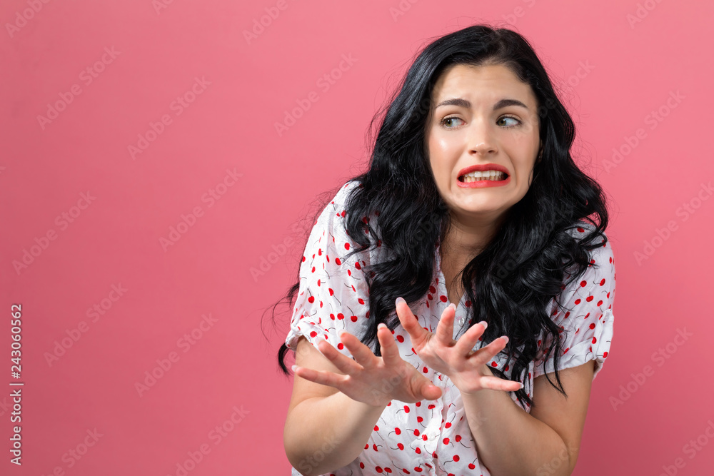 Disgusted face expression with young woman on a solid background Stock ...