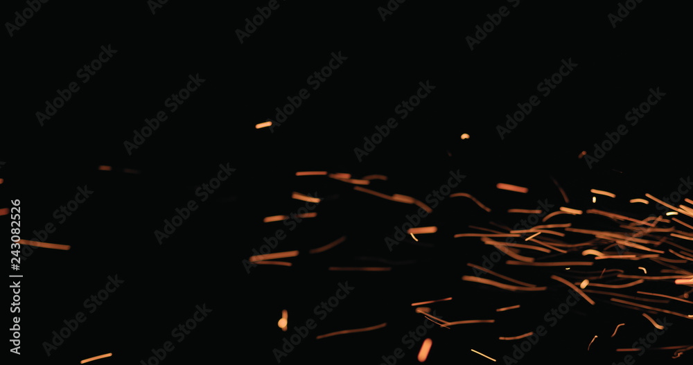 hot sparks floating from side on black background Stock Photo | Adobe Stock