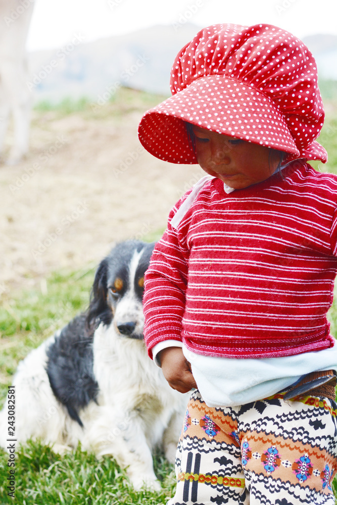 Sad native american little girl wearing red hat. Stock Photo | Adobe Stock