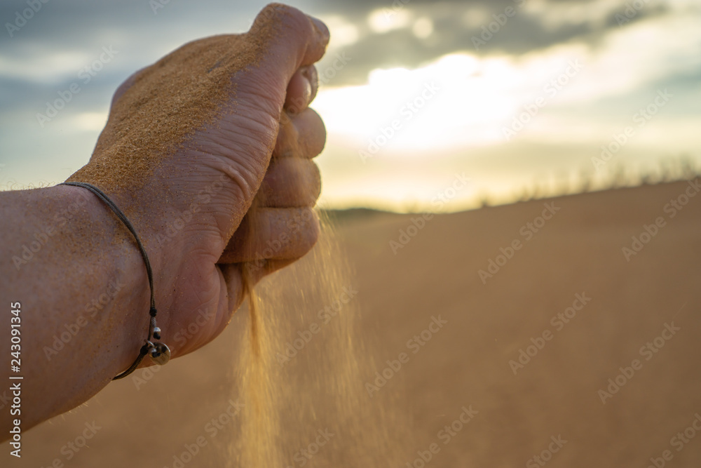 Sand dripping out of a Hand in the Red Sand Dunes in Mui Ne Stock Photo ...