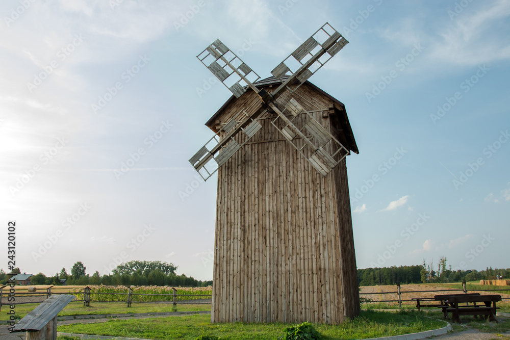 Historic Polish wooden windmill and blue sky Stock Photo | Adobe Stock