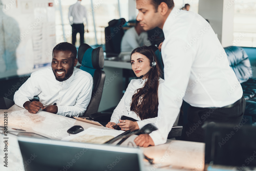 Dispatcher team looking at navigation data board Stock Photo | Adobe Stock