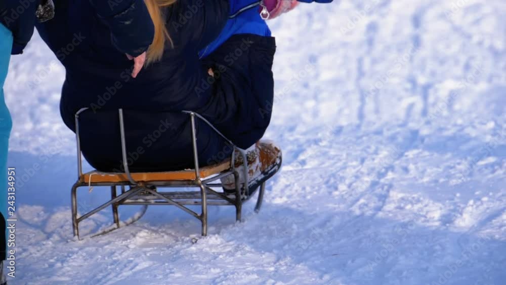 Children Sledding Down a Snowy Hill. Slow Motion in 180 fps. Happy kids ...