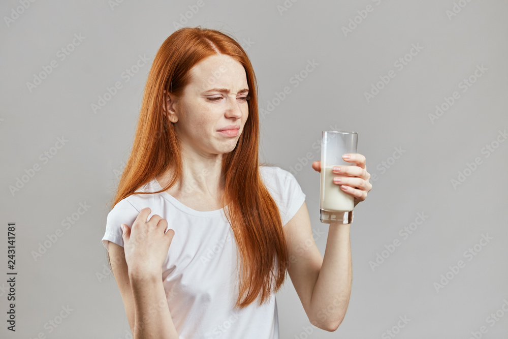 sad angry girl hate milk. dislike, frustration, disgusting drink ...
