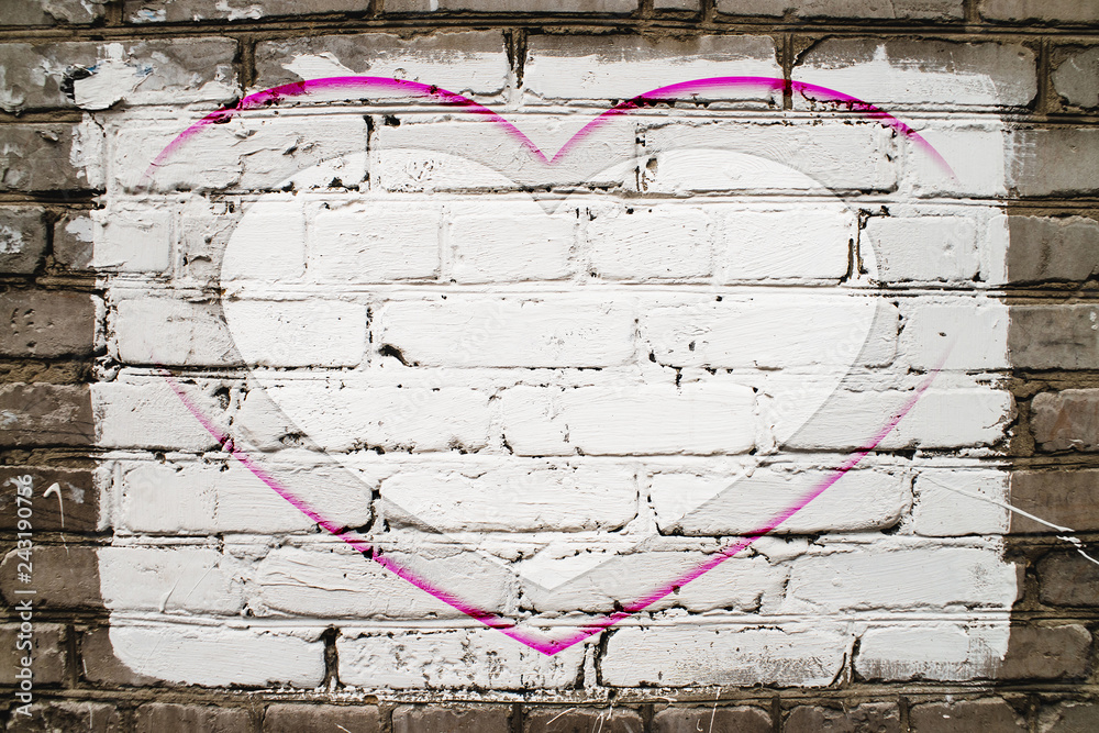 Pink drawn heart on brick wall with white paint close-up. Mock up ...