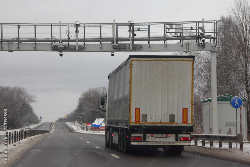 Road inspection - truck with semi trailer convoy driving under ...