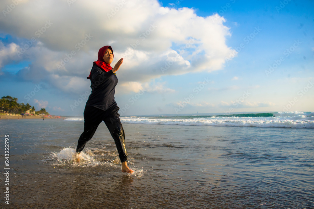 young healthy and active runner Muslim woman in Islam hijab head scarf ...