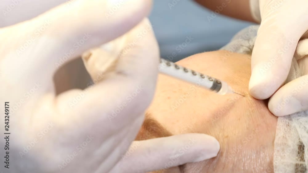 Face botox injection. Beauty facial lifting procedure. Beautiful young ...