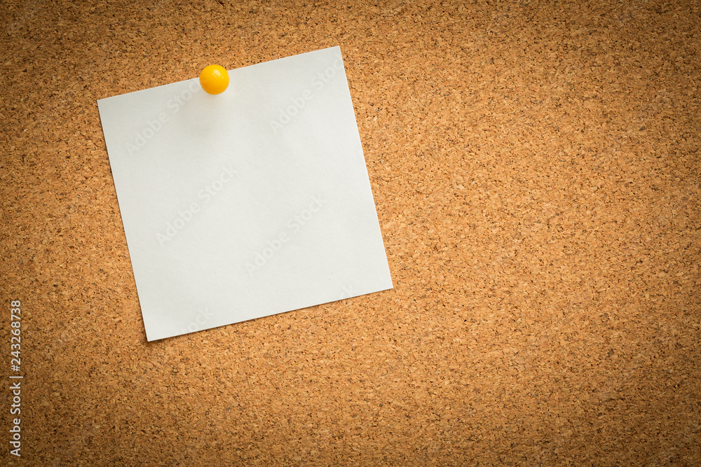 yellow pin white paper on cork board texture or background for note ...