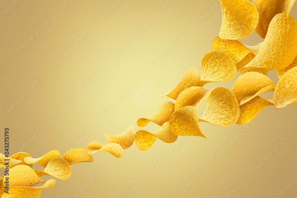 Flying potato chips, isolated on yellow gradient background Stock Photo ...