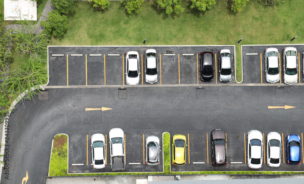Aerial view of car-park, car parking lot and cars with drive way and ...