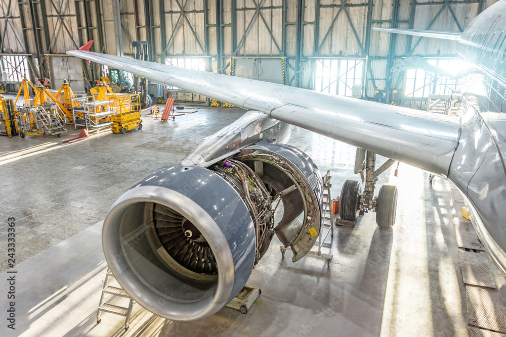Opened aircraft engine in the hangar, maintenance. Wing view Stock ...