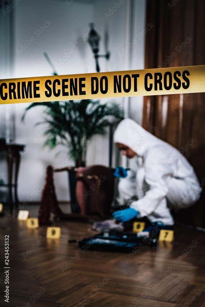 Forensic Expert Collecting Evidence from The Crime Scene Stock Photo ...