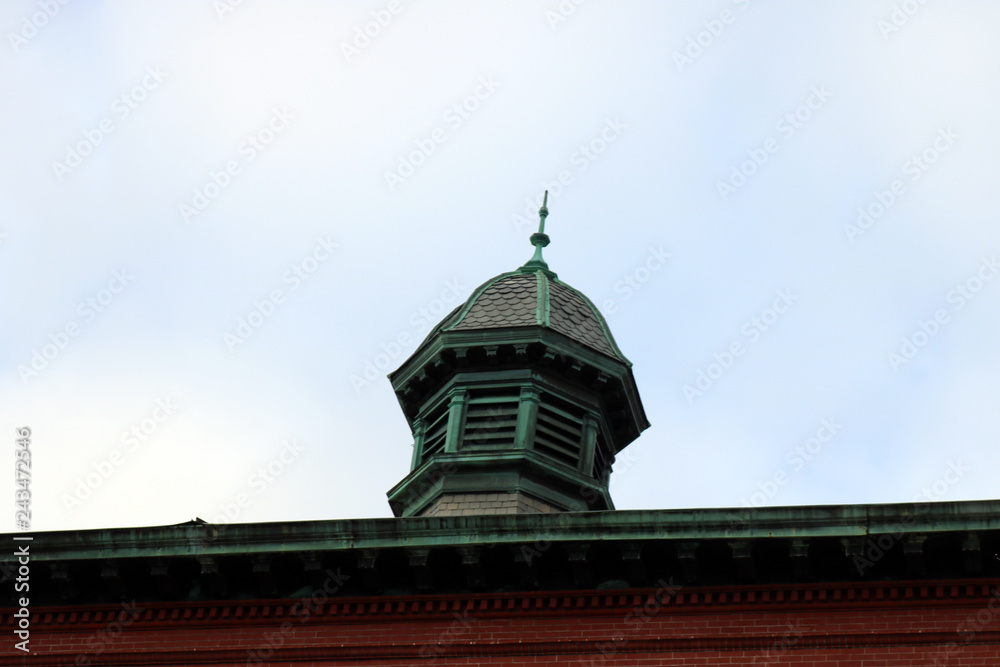 Weathered patina tower on old historic brick building Stock Photo ...