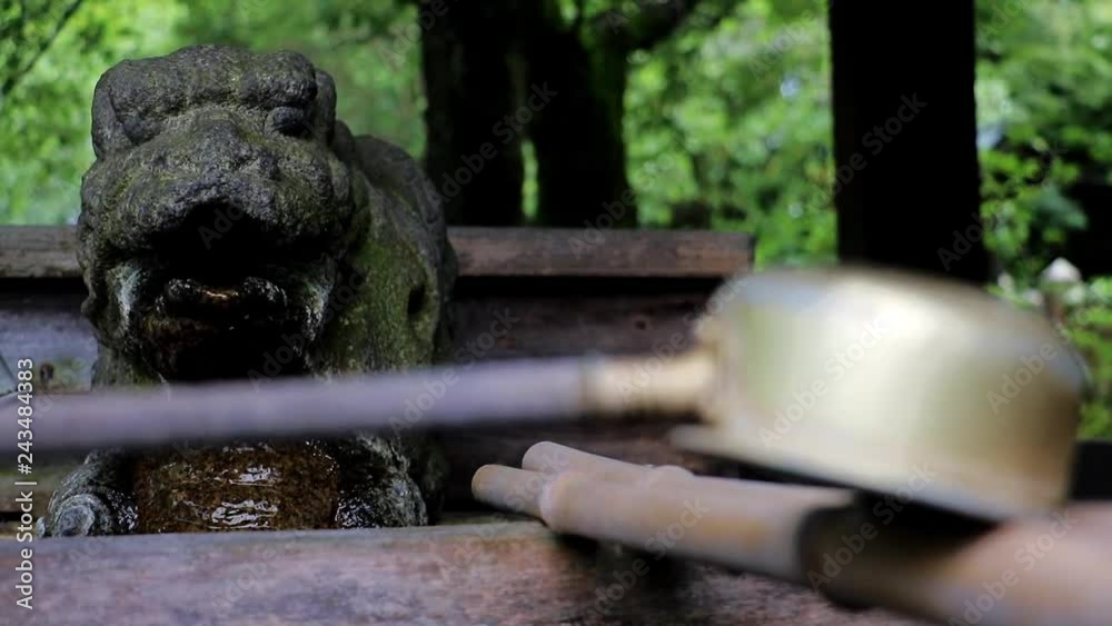 Change focusing at a ladle at the well with a water spout, shrine at ...