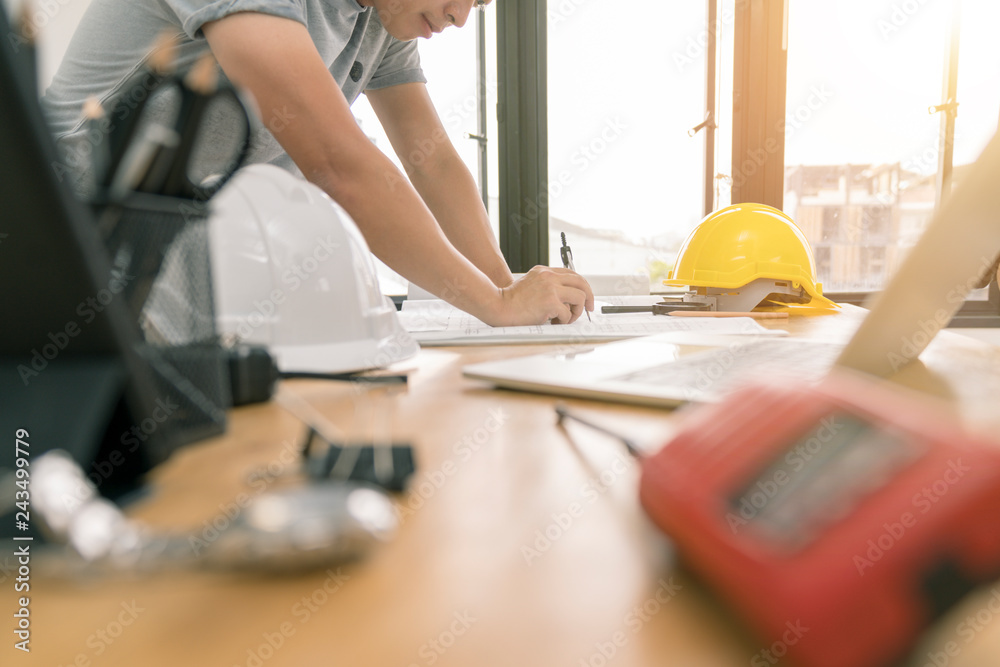 architect or civil engineer during drawing home or building in office ...
