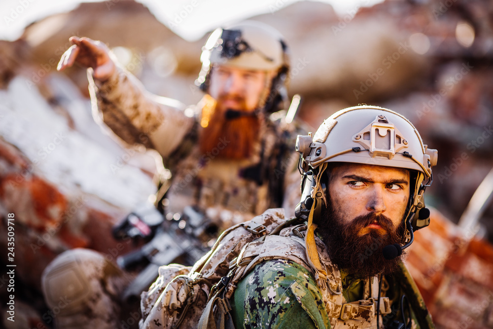 rangers with assault rifles on battlefield background. army, military ...