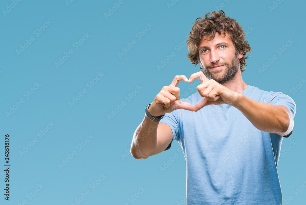 Handsome hispanic model man over isolated background smiling in love ...