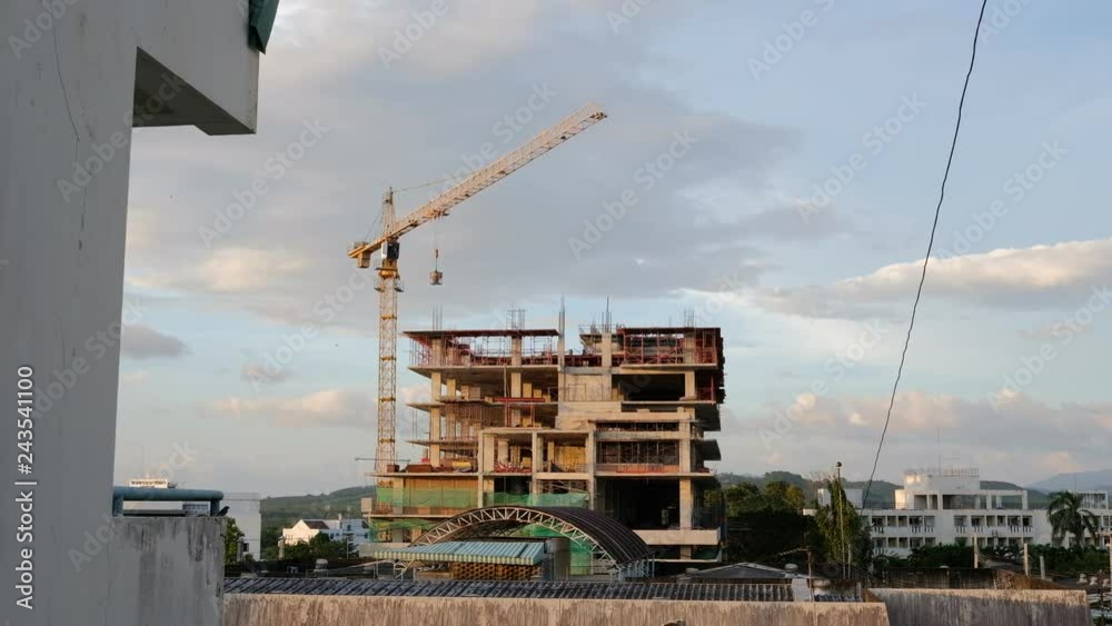 Crane lift formwork to construction building Stock Video | Adobe Stock