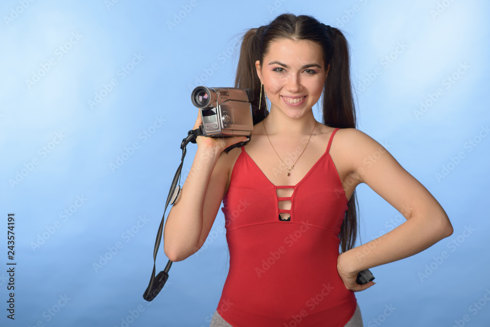 Girl with VHS video camera Stock Photo | Adobe Stock