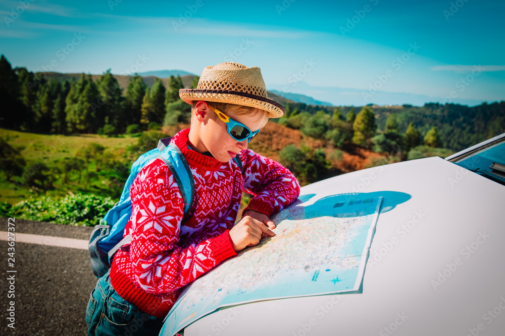 little boy looking at map while travel by car in nature Stock Photo ...