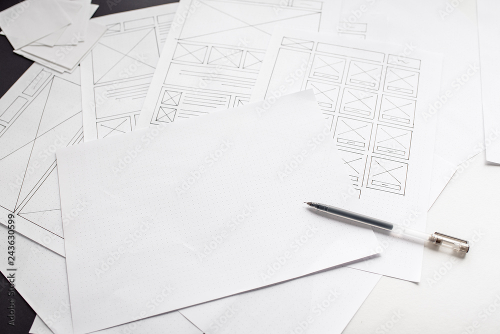 UX website designer drawing wireframe sketch of prototype, framework ...