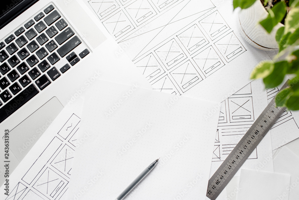 UX website designer drawing wireframe sketch of prototype, framework ...