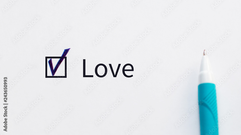 Love - checkbox with a tick on white paper with blue pen. Checklist ...