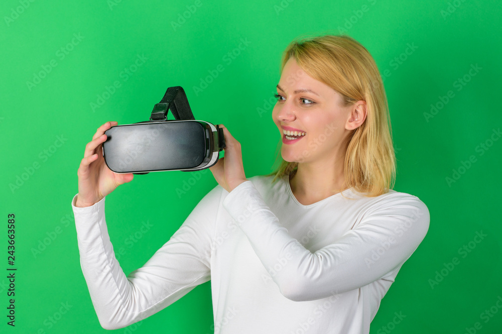 Amazed young woman touching the air during the VR experience. Young ...