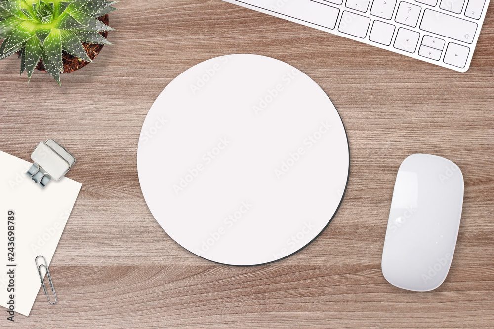 Mouse pad mockup. Round white mat on the table with props, mouse and ...