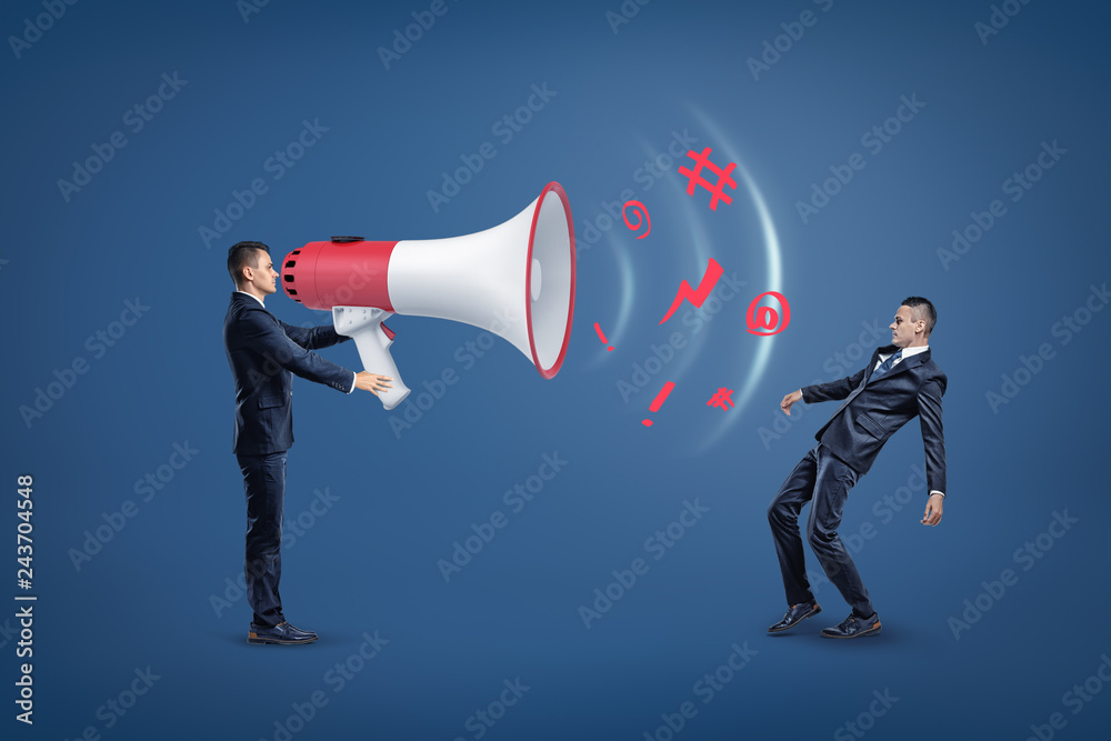 Businessman with huge loud-speaker uttering a message encoded in ...