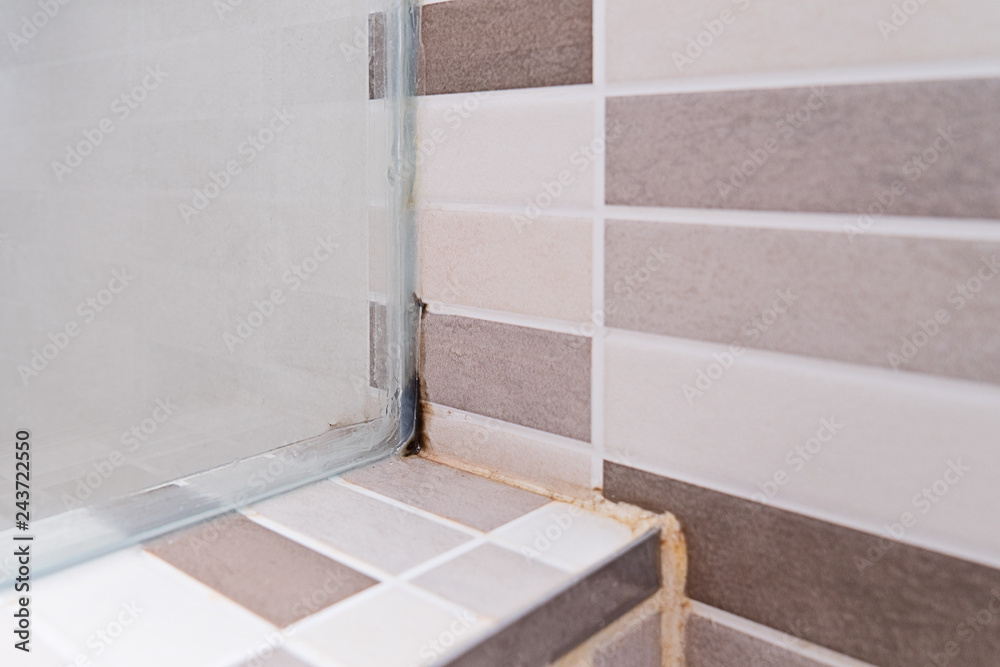 Black mold on tile in shower cabin. Poor ventilation, humidity ...