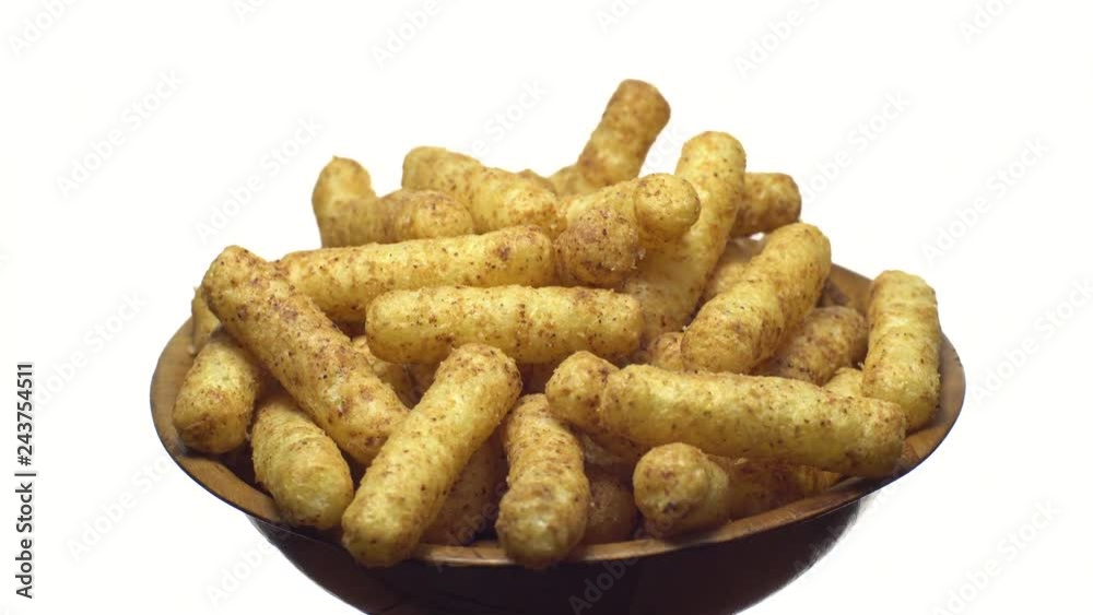 Corn puffs. Rotation. Close up. Puffcorn with peanut flavor. Corn ...