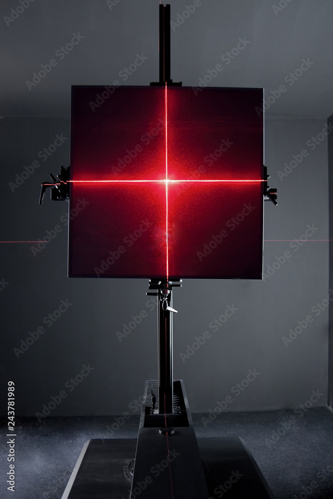 Red laser beams light effect on led luminaire on stand photometric lab ...