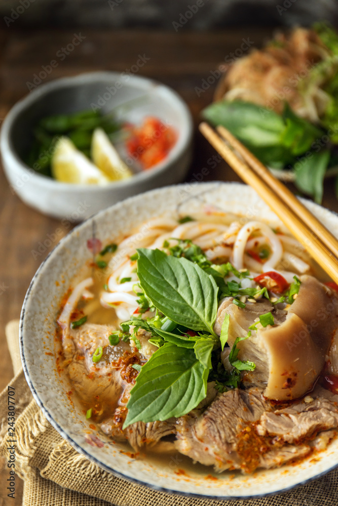 Bun Bo Hue, Bun Bo, Vietnamese beef noodle soup spicy. A bowl of beef ...