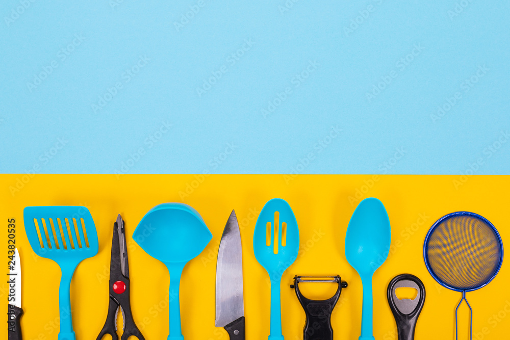 Design concept of kitchen utensils isolated with copyspace on blue ...