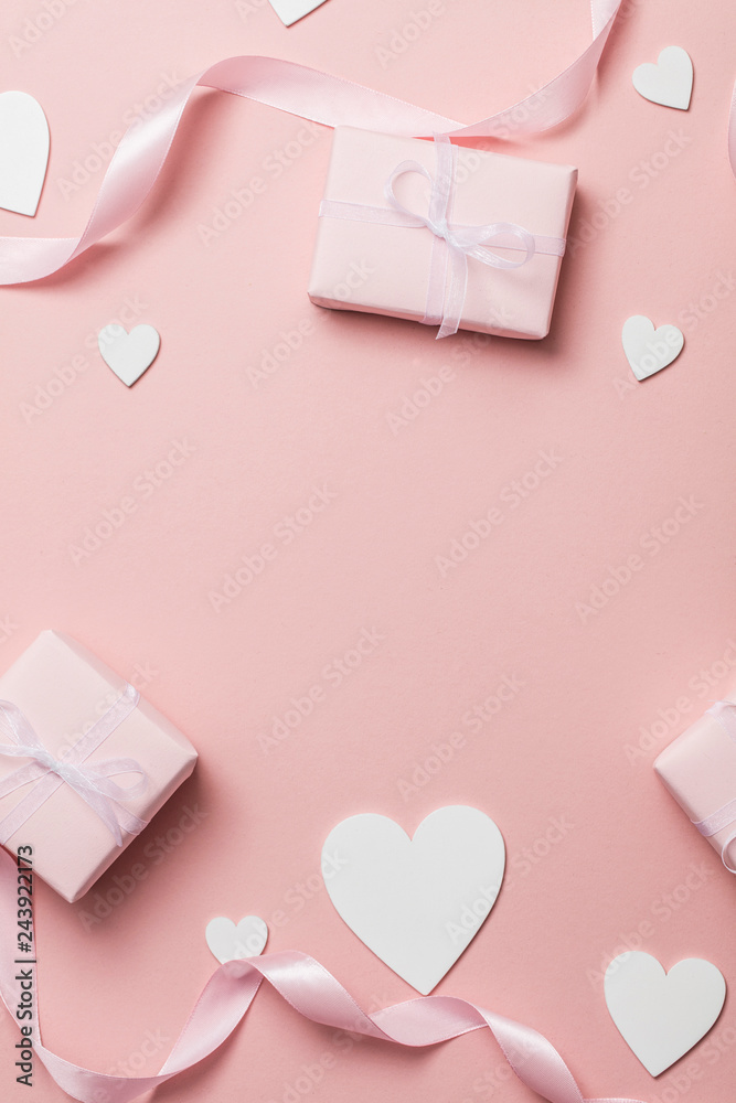 Pink valentine gift frame layout with white hearts on a pastel pink ...