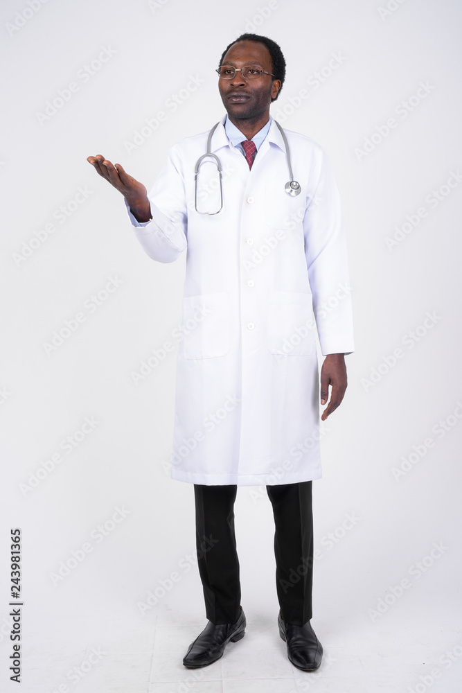 Full body shot of African man doctor explaining something Stock Photo ...
