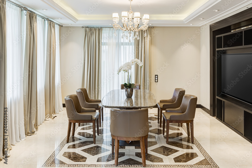 Stylish dining room with big wooden table. Stock Photo | Adobe Stock